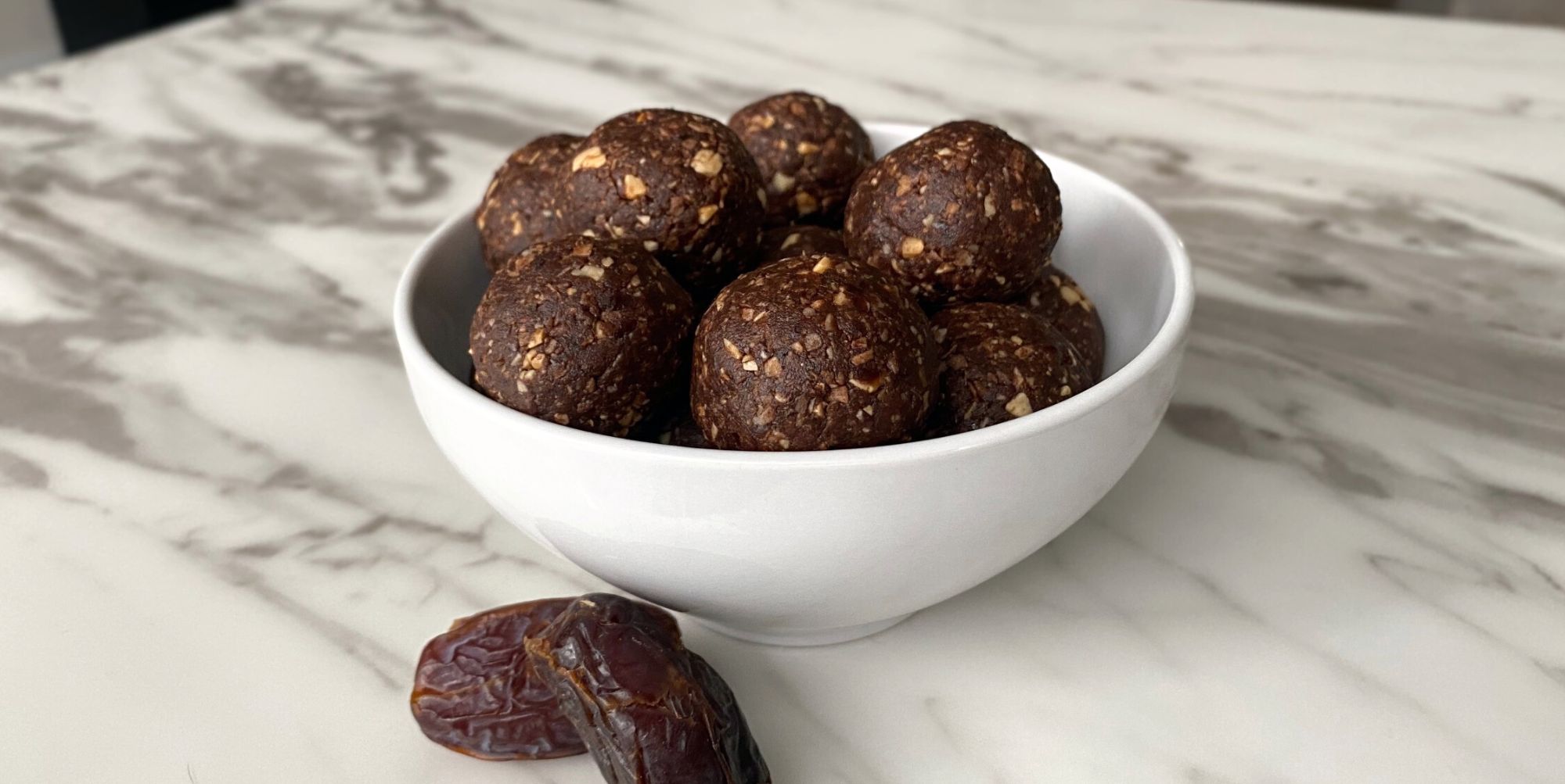 Nutrient-Packed Date Delights: Chocolate-Coconut Energy Bites